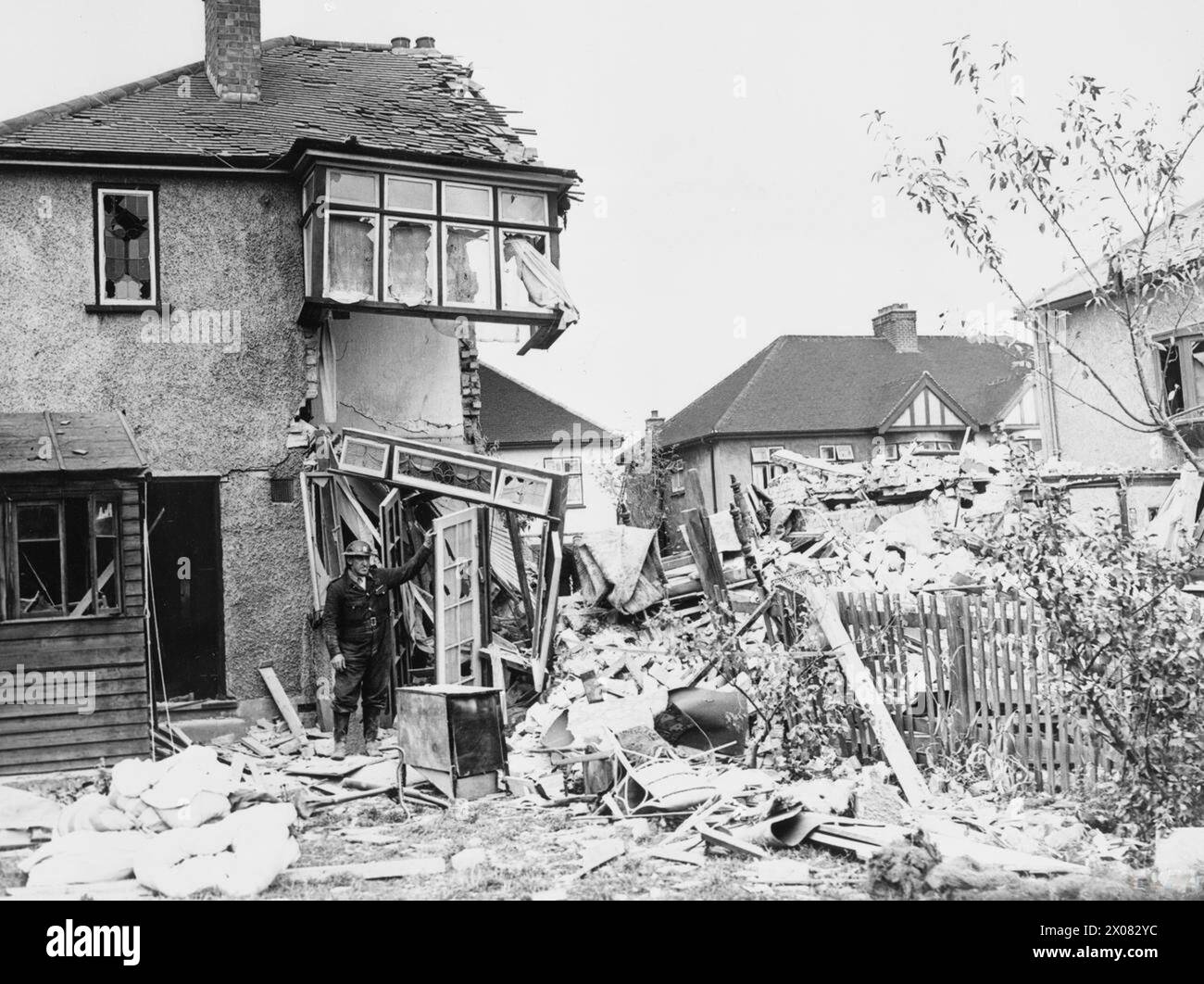 A semi-detached house is destroyed after a German bomb directly hits ...