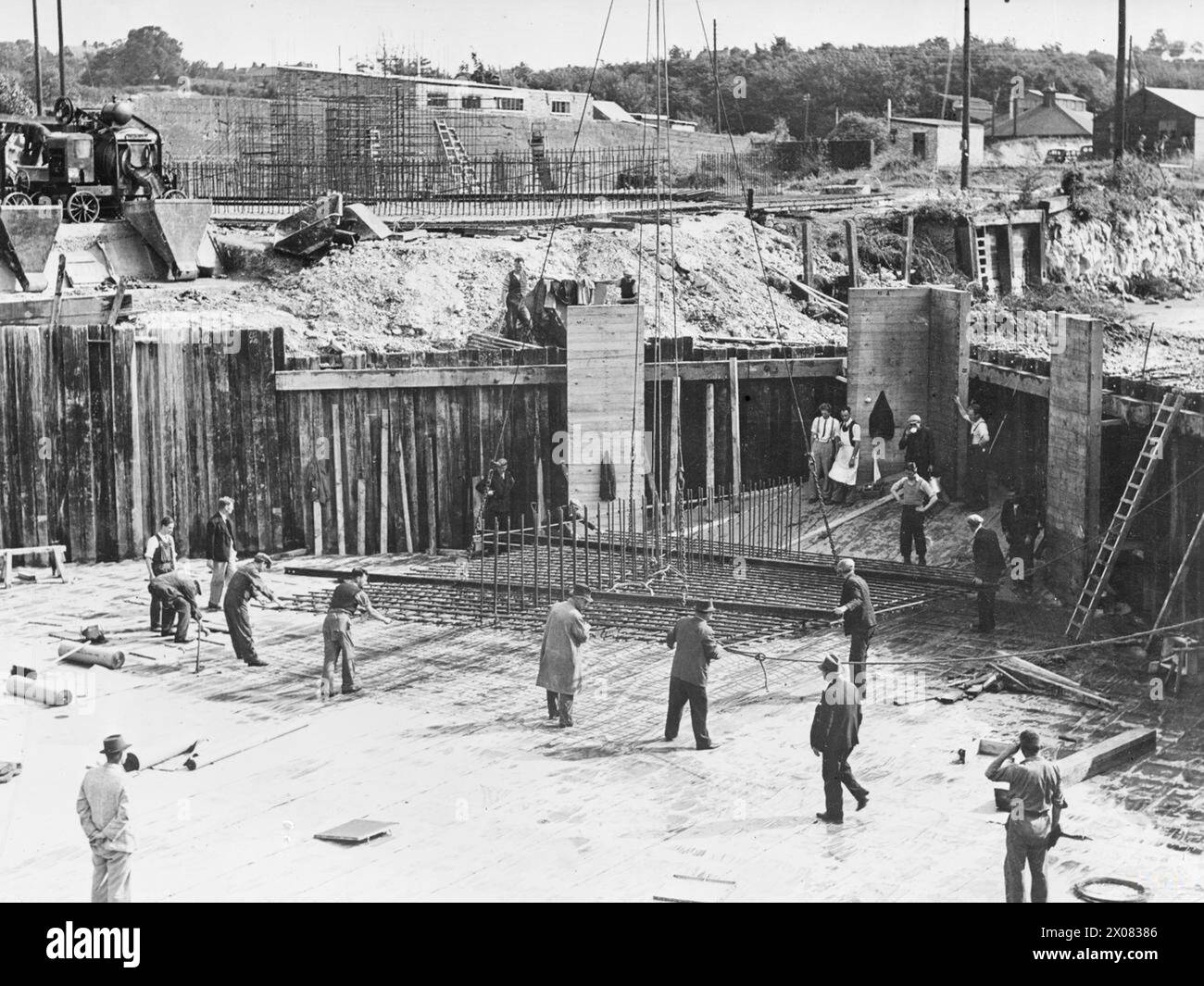 Pre-assembled reinforcement cages are placed on a reinforced concrete ...