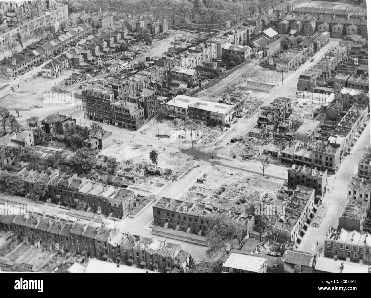 BOMB DAMAGE IN LONDON, ENGLAND, APRIL 1945 - Aerial view from the north ...