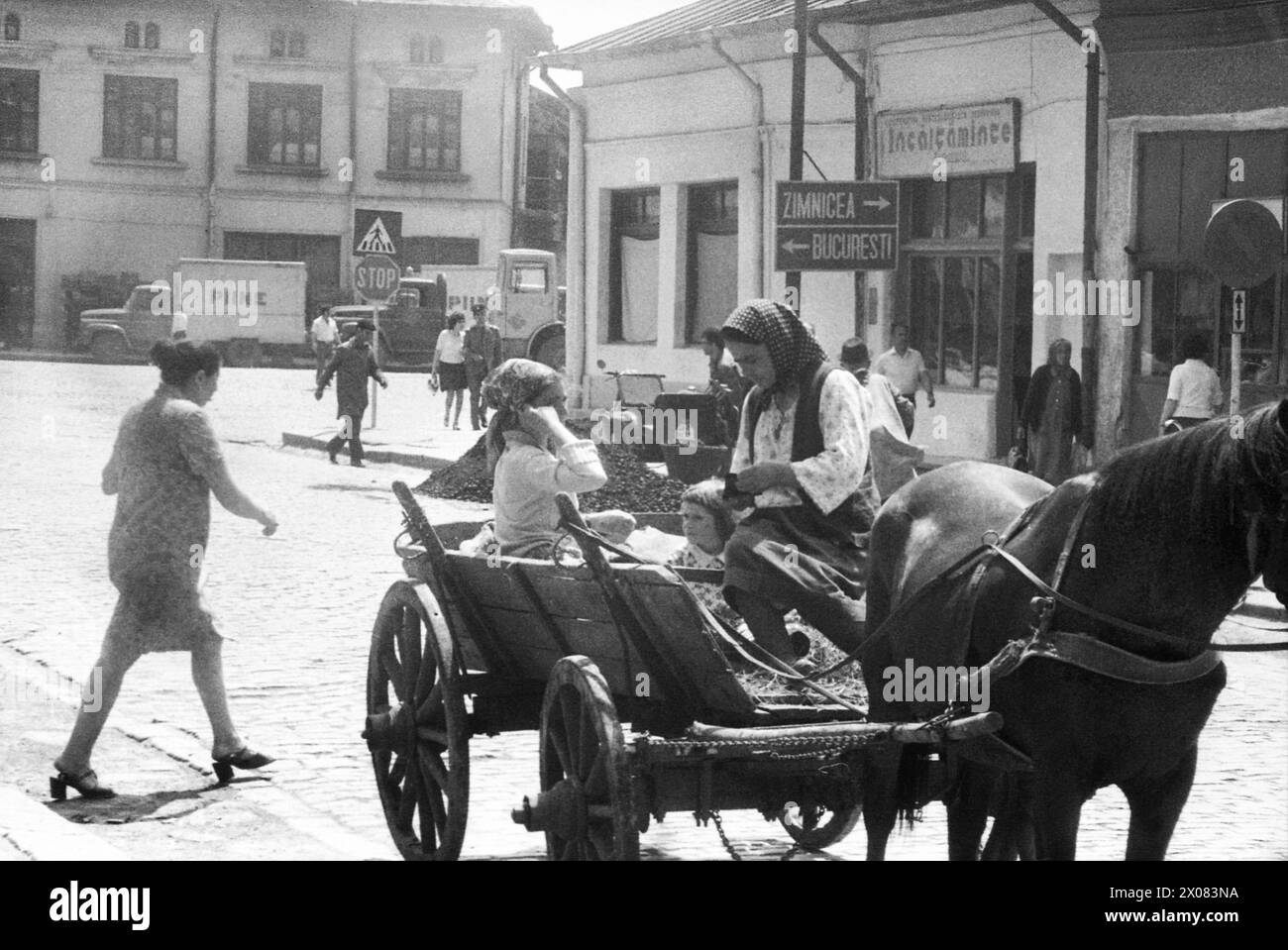 Socialist Republic of Romania in the 1970s. Women riding a horse-drawn ...