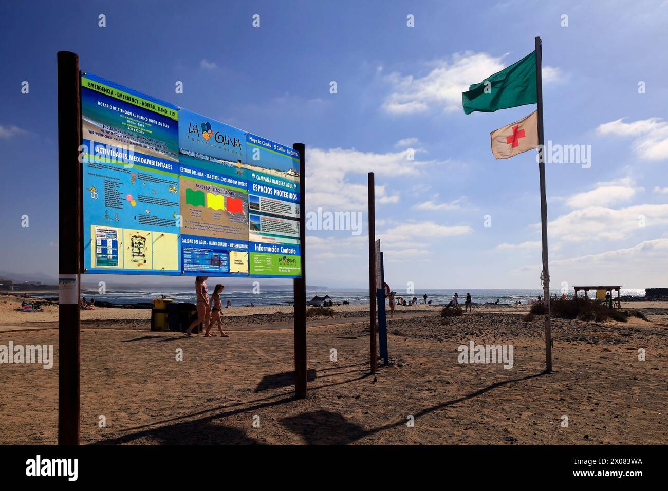 Beach information sign and beach flags, El Cotillo, Fuerteventura ...