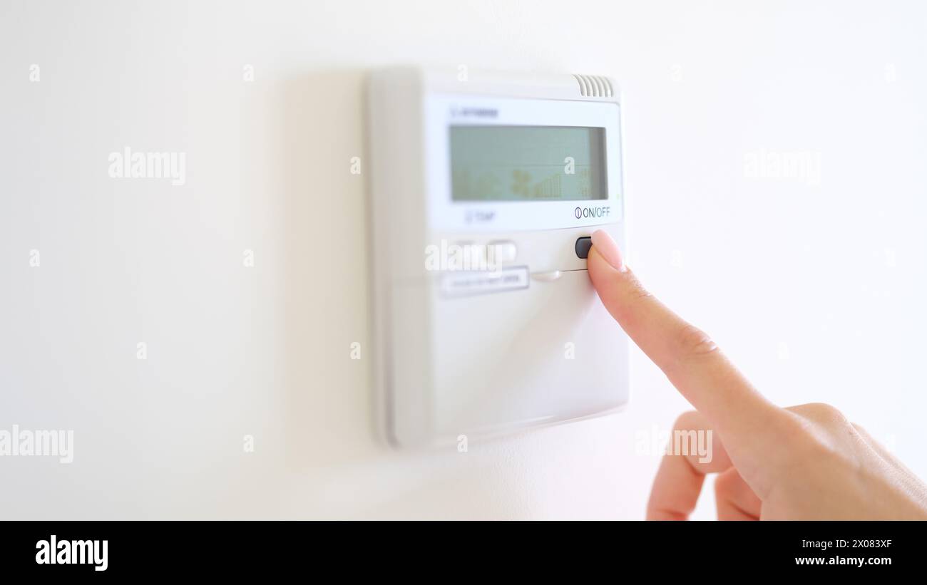 Wall mounted digital climate control and home thermostat Stock Photo ...