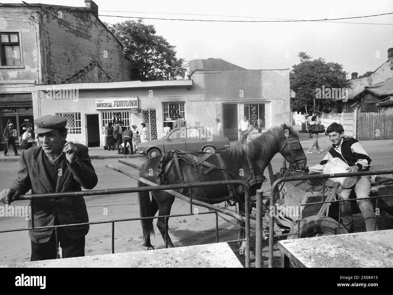 Socialist Republic of Romania in the 1970s. People with a horse and ...