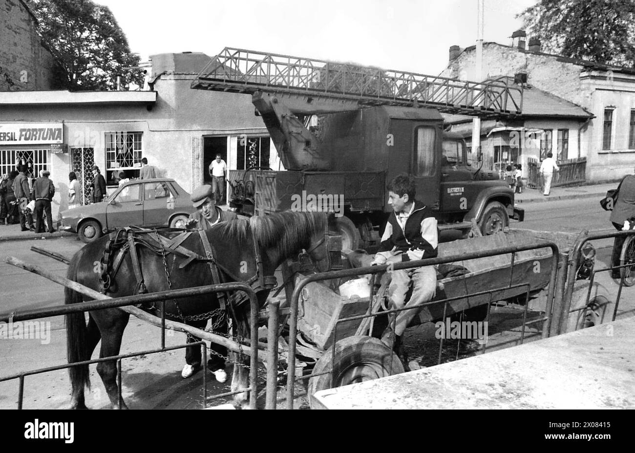 Socialist Republic of Romania in the 1970s. People with a horse and ...