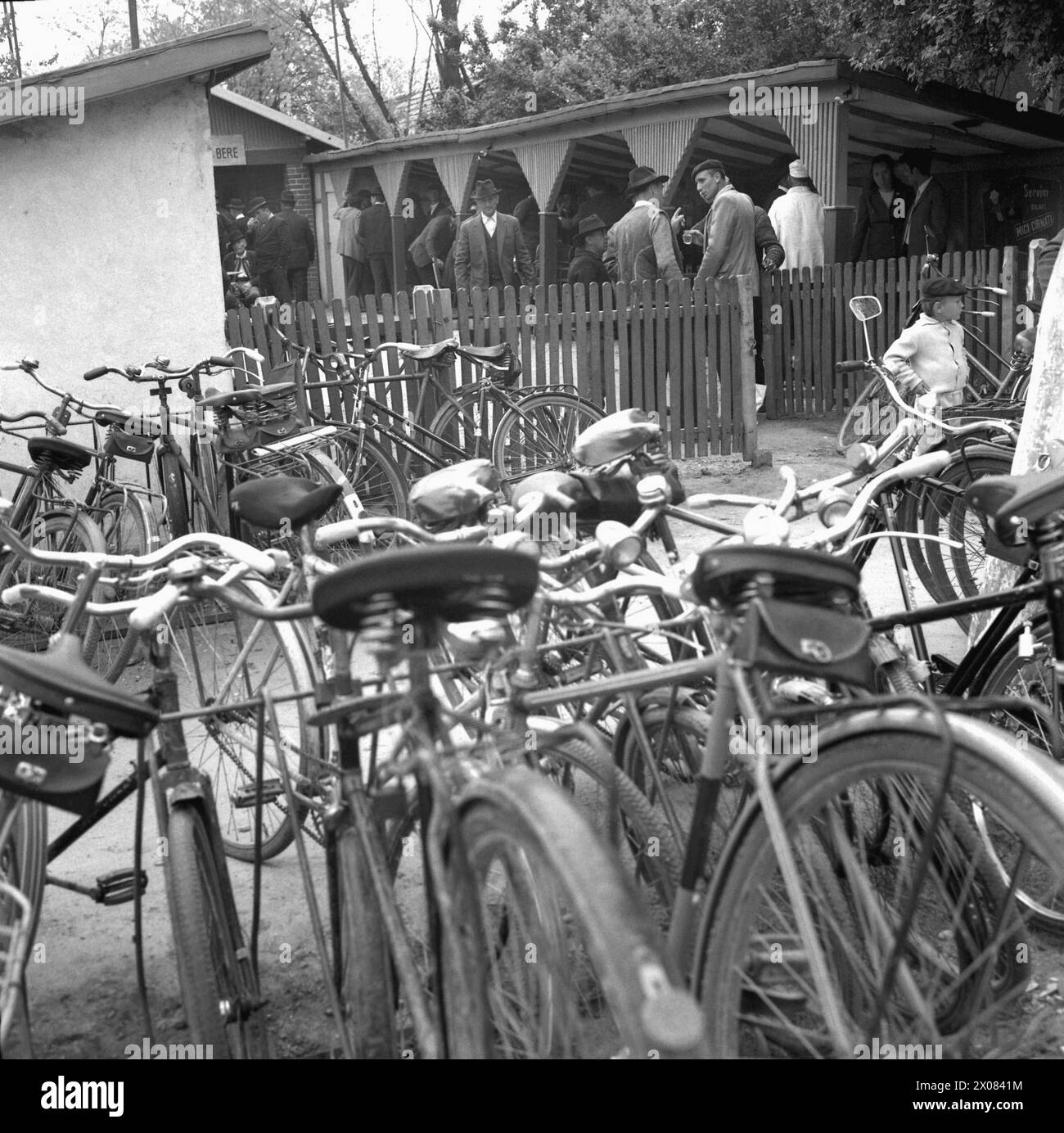 Socialist Republic of Romania in the 1970s. Dozens of bicycles outside a local bar in a village ...