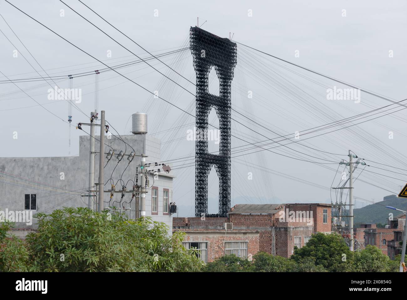Tiandong County, Baise, Guangxi, China - February 03, 2022: Steel frame and cable-assisted ...