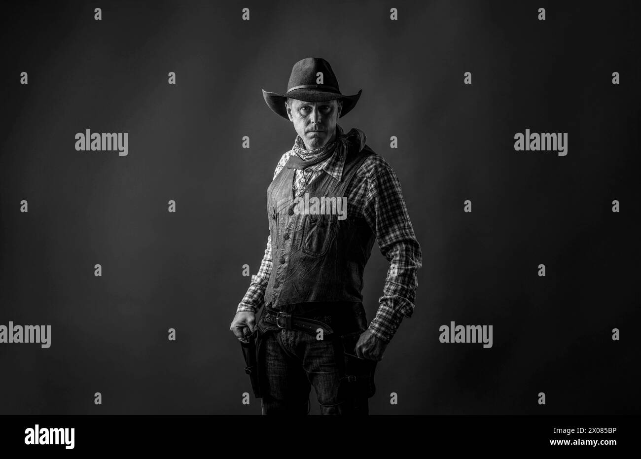 Man wearing cowboy hat, gun. West, guns. Portrait of a cowboy. Cowboy ...