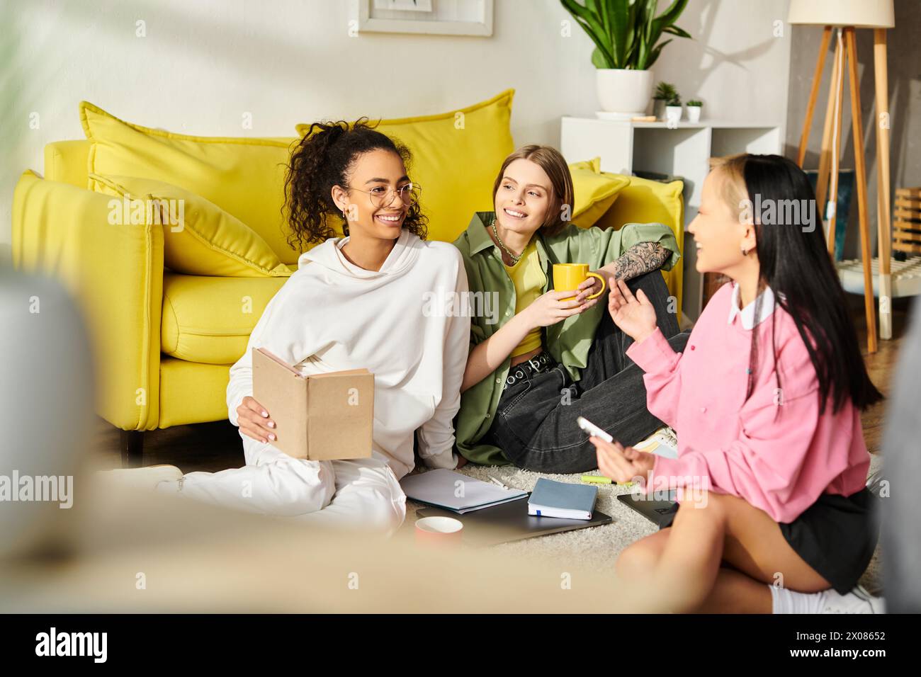 A diverse group of teenage girls engage in deep conversation while ...