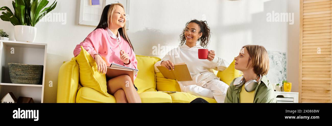 A diverse group of teenage girls studying together on a vibrant yellow ...