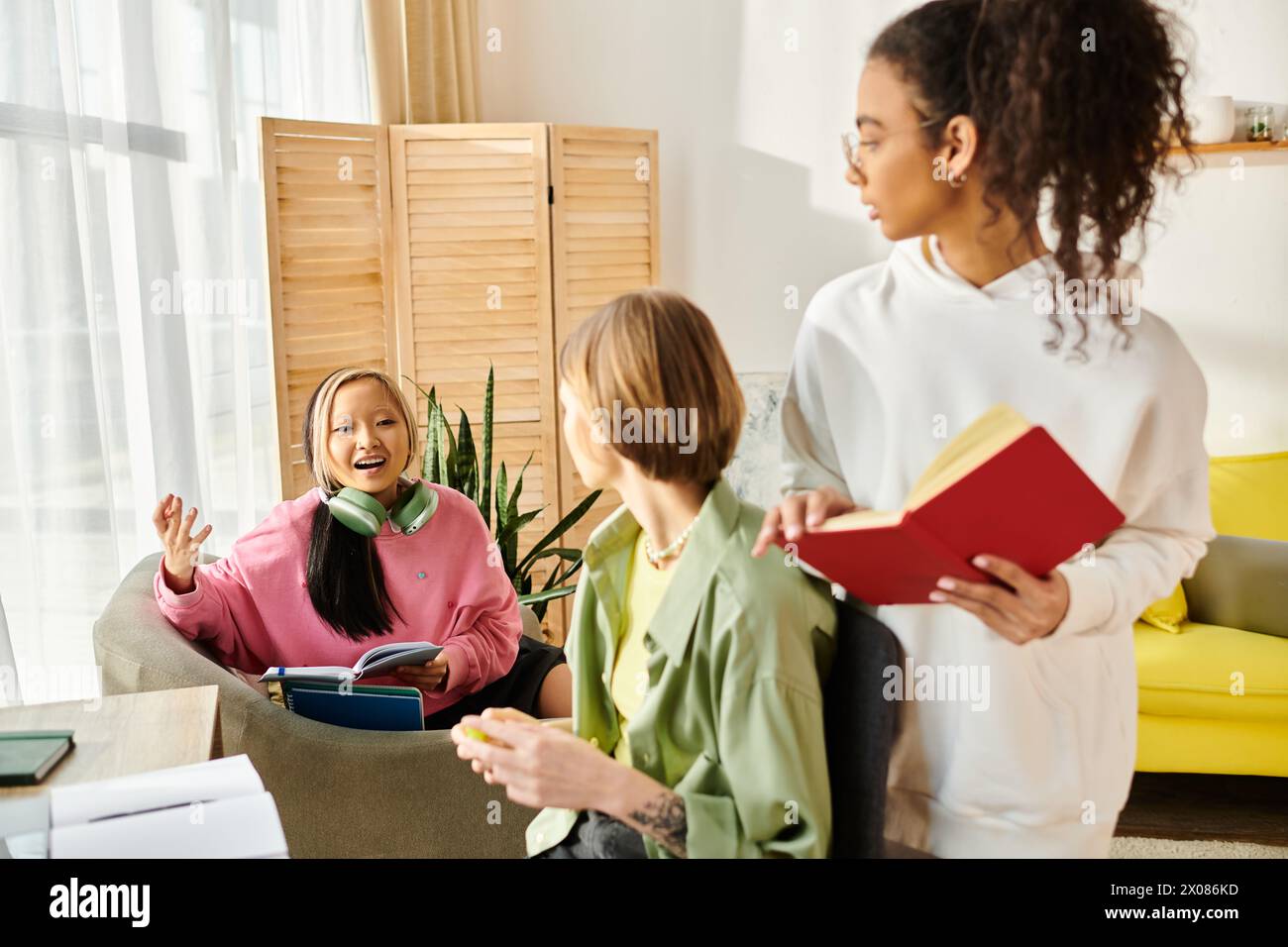 A diverse group of teenage girls engage in studying and bonding in a ...