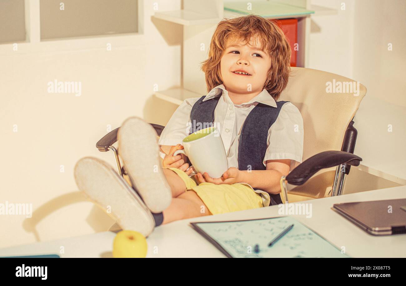 Funny homeschooling for kids. Little boss in the office, businessman ...