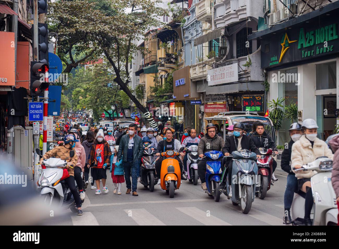 HANOI, VIETNAM - JANUARY 1 - 2024: Street scene in Ha Noi, Vietnam with ...