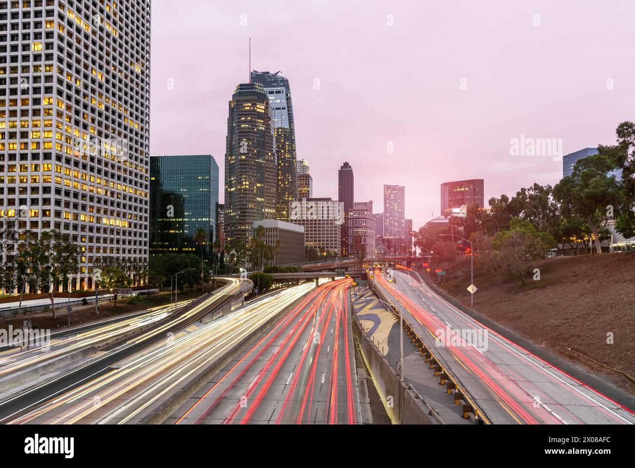 Long Exposure of a busy freeway bordering Los Angeles downtown high ...