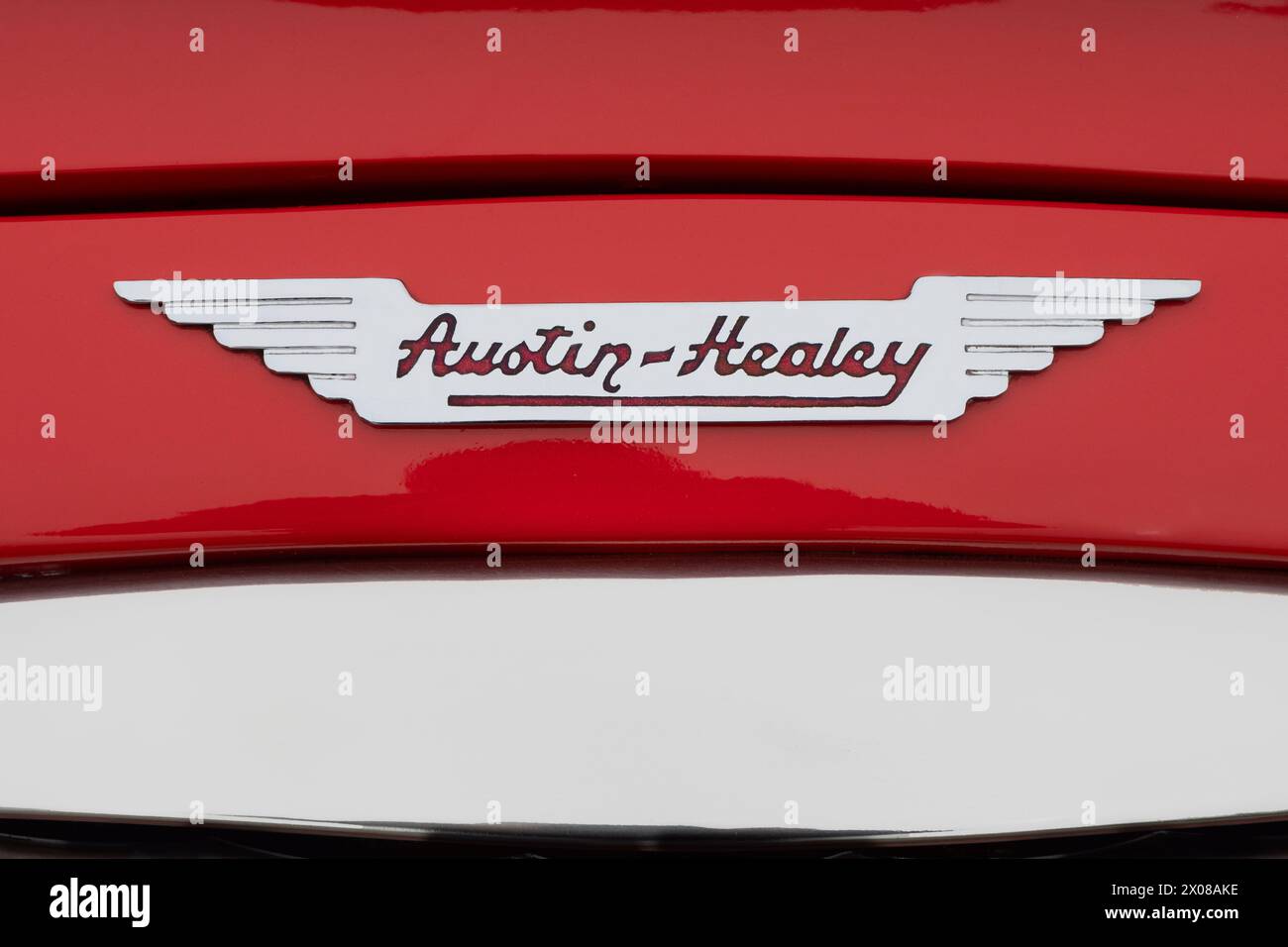 An Austin Healey Logo on a red car Stock Photo - Alamy