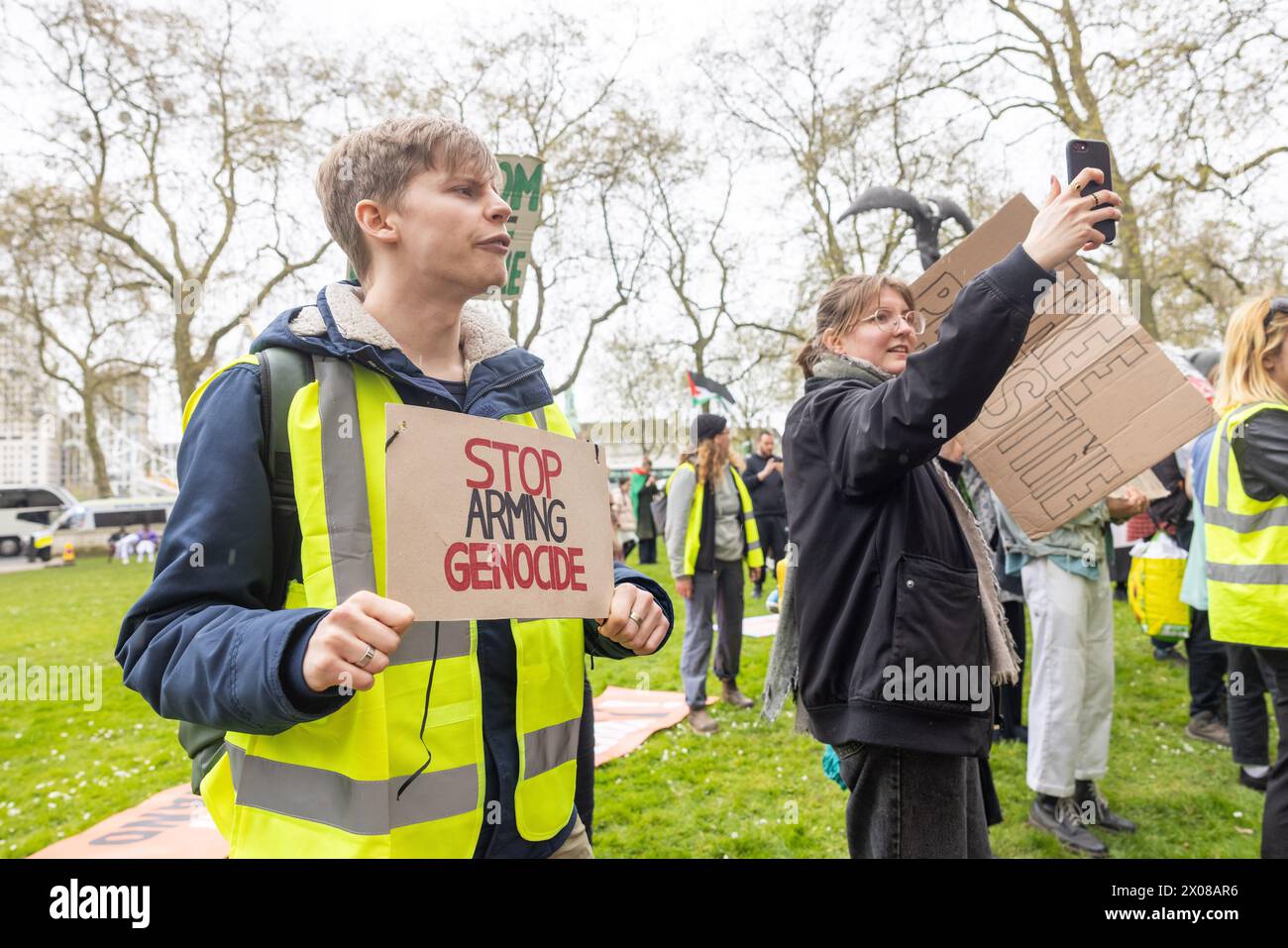 London, UK. 10 APR, 2024. Man holds "Stop arming genocide" sign as ...