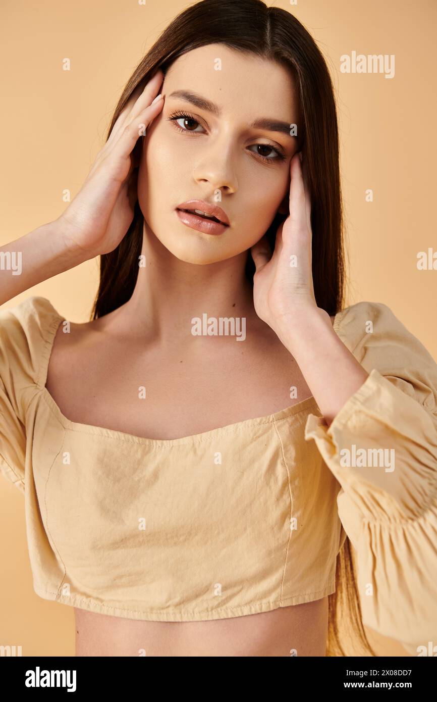 A Young Woman With Long Brunette Hair Strikes A Confident Pose Showcasing A Summer Outfit In A