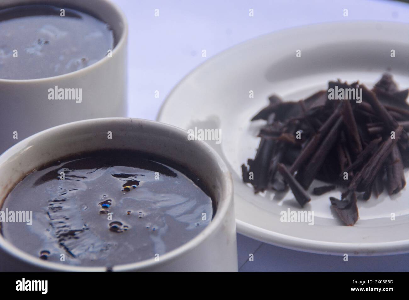 hot chocolate drink in a white cup. Its thick texture is drunk when it ...