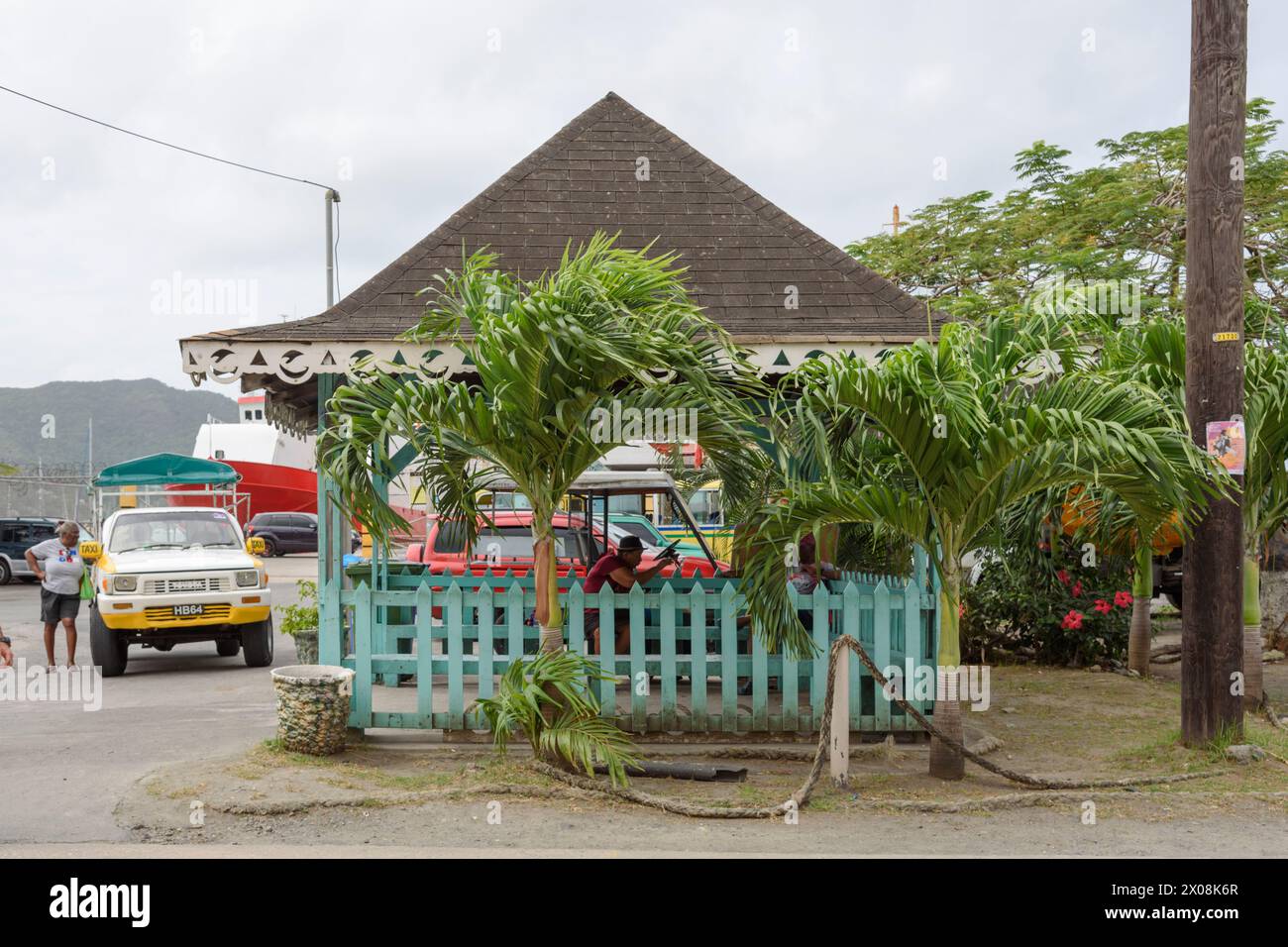 Colourful painted covered bus stop shelter, Port Elizabeth, Bequia ...