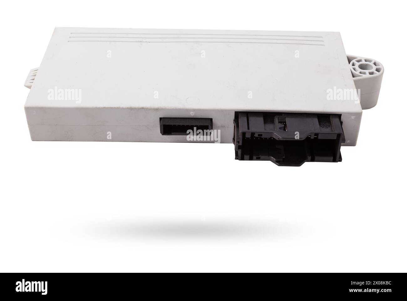 Plastic car engine control unit with metal elements on a white isolated ...