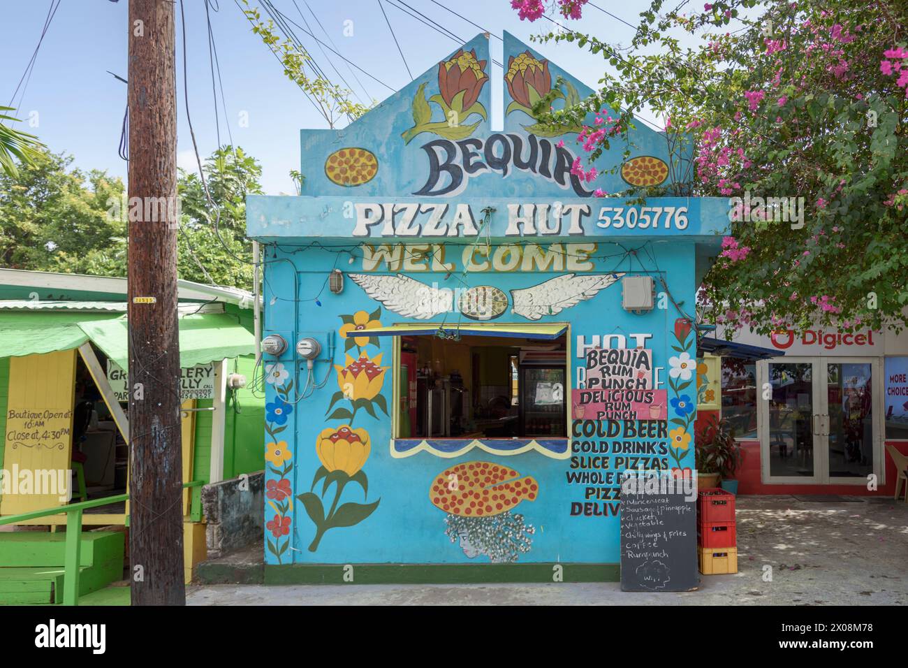 Colourful painted Pizza Hut pizza stall in Port Elizabeth, Bequia ...