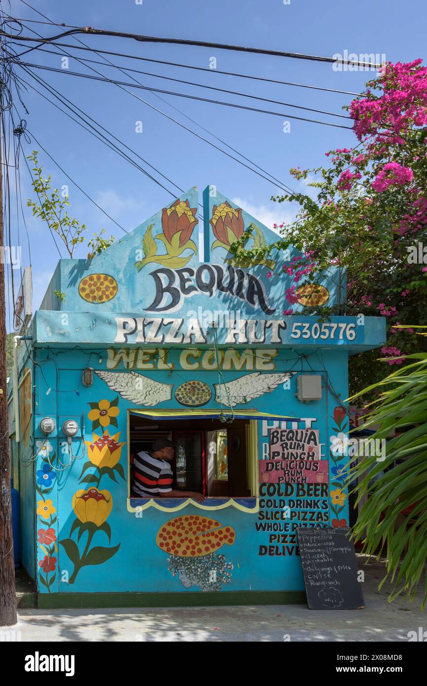 Colourful painted Pizza Hut pizza stall in Port Elizabeth, Bequia ...