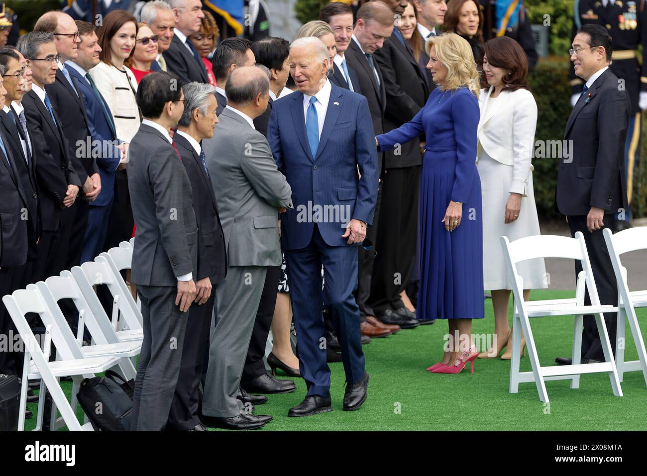 President Joe Biden and Japan's Prime Minister Fumio Kishida greet each ...