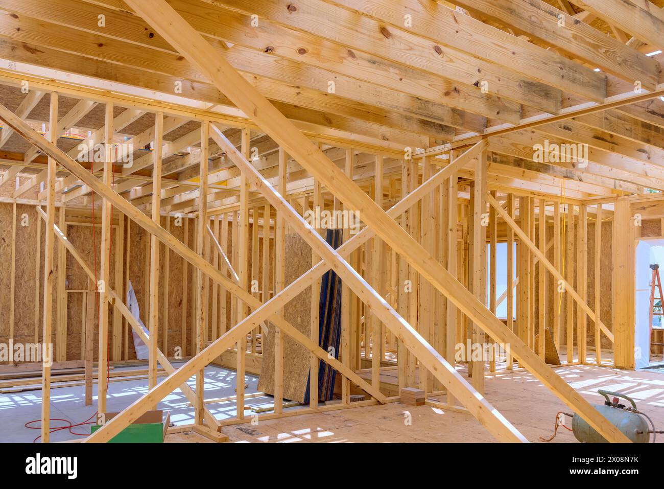 New unfinished residential home under construction framing of wood ...