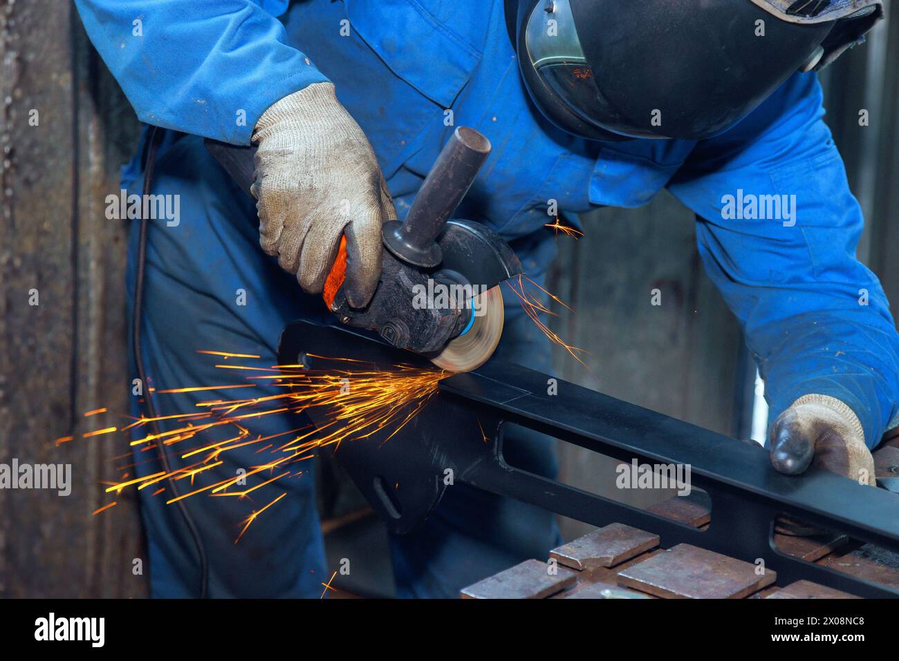 Working with sparks from an angle grinder in metalworking with special ...