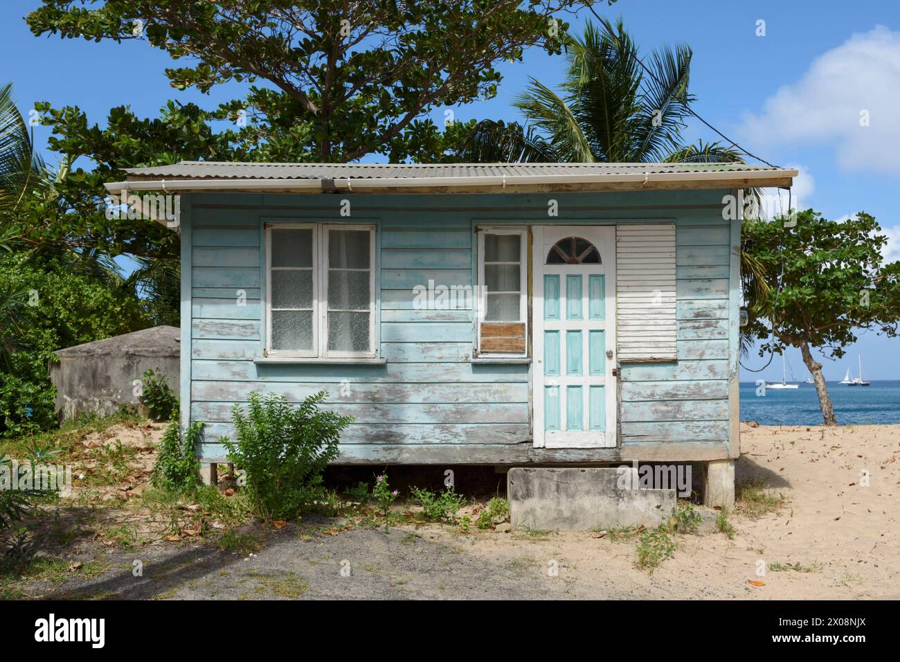 Blue painted wooden beach hut on Lower Bay beach, Lower Bay. Bequia ...