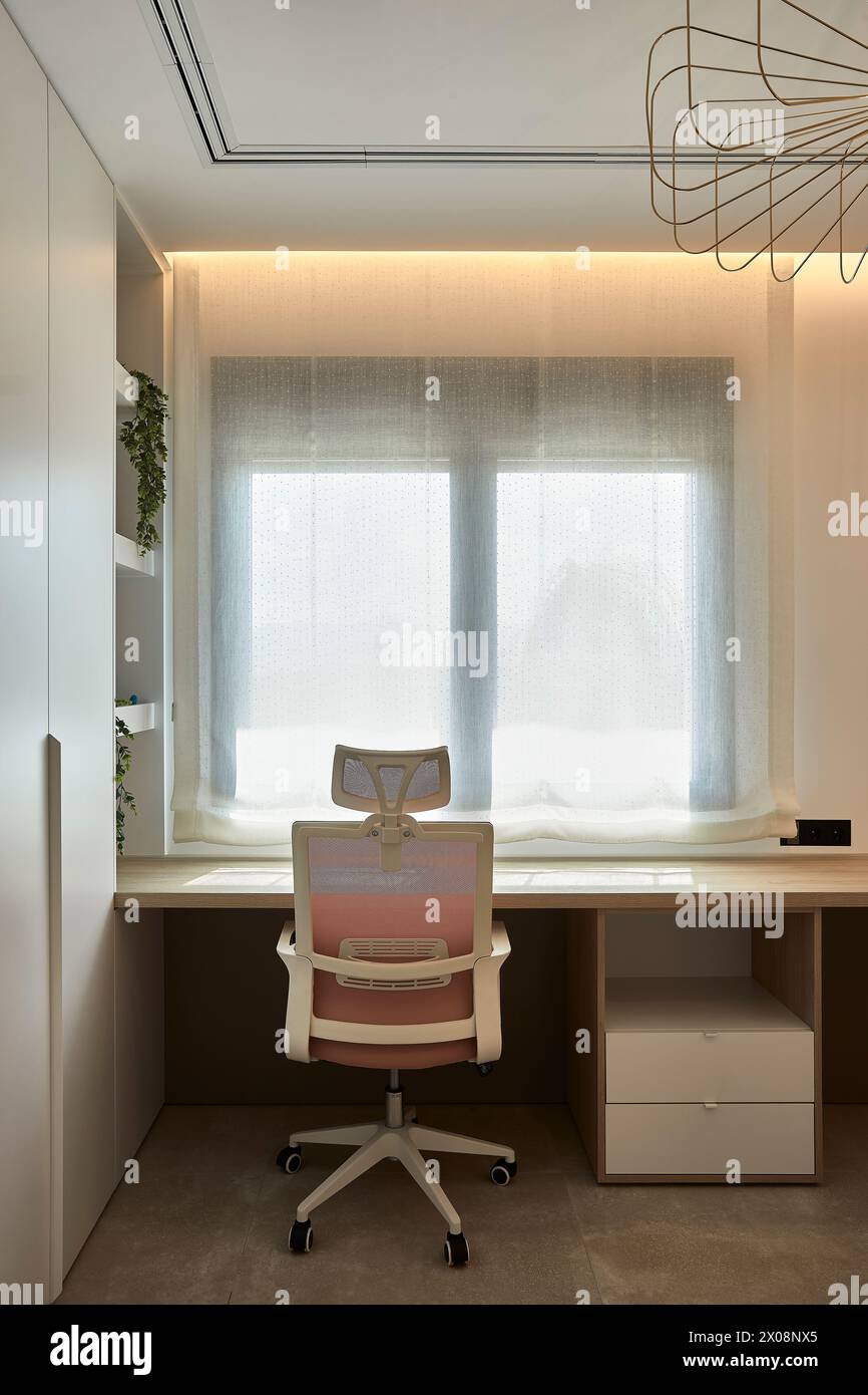 A cozy home office setup with a stylish ergonomic chair in front of a ...