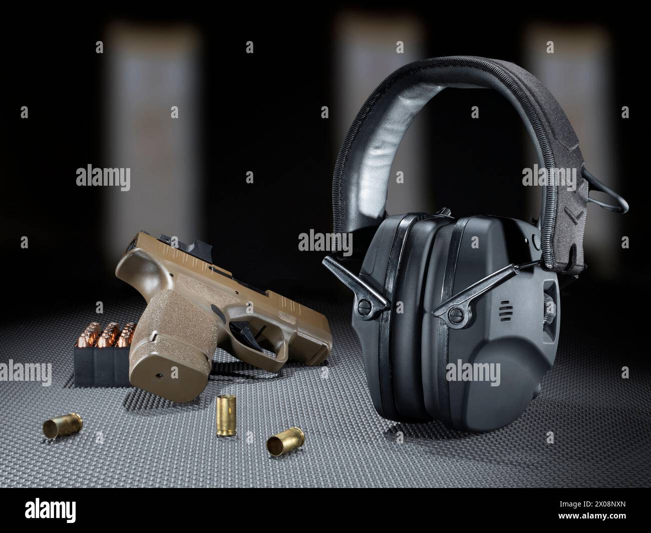 Semi automatic 9 mm handgun with ammunition and electronic hearing ...