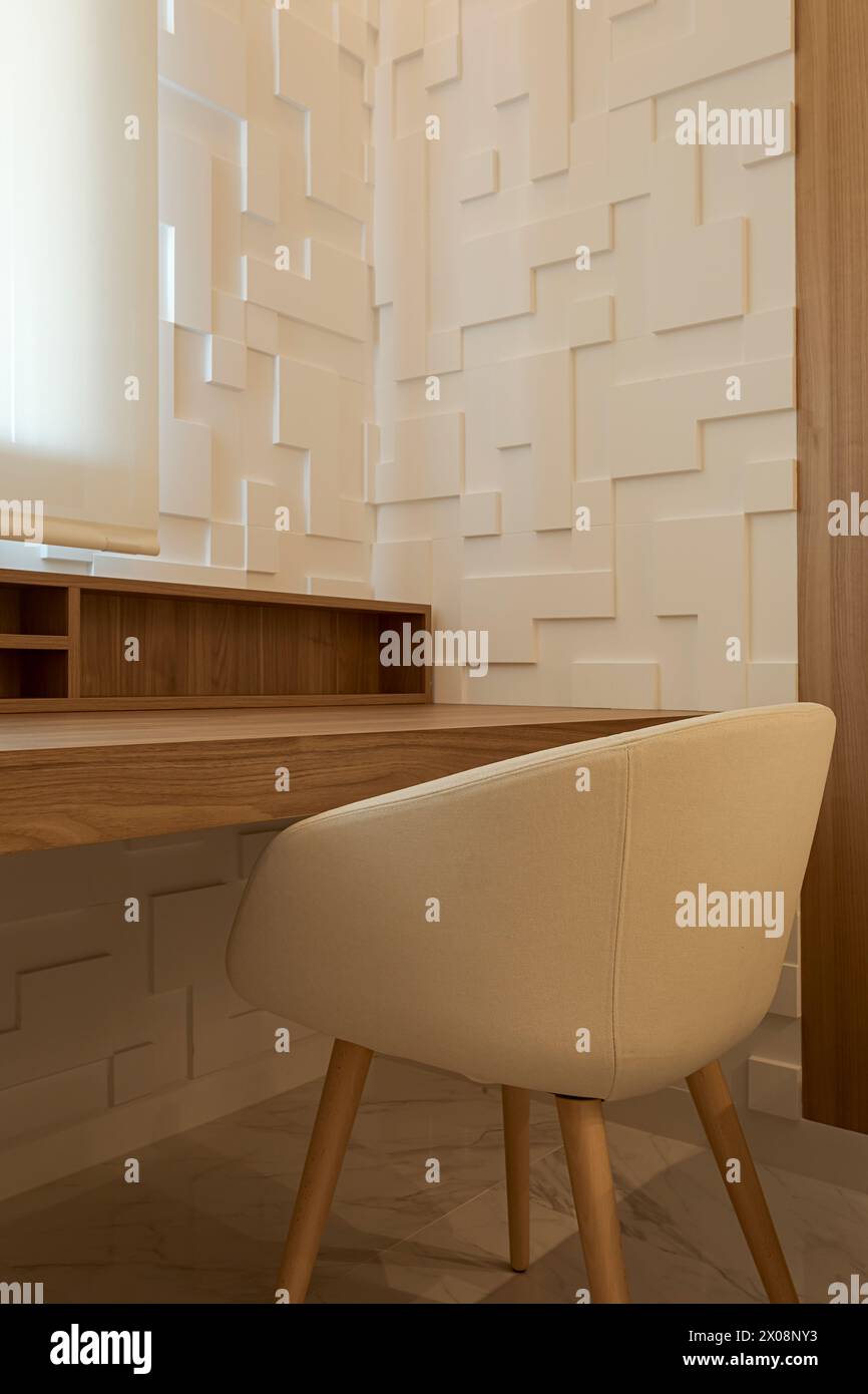 A minimalist interior featuring a contemporary beige chair against a ...