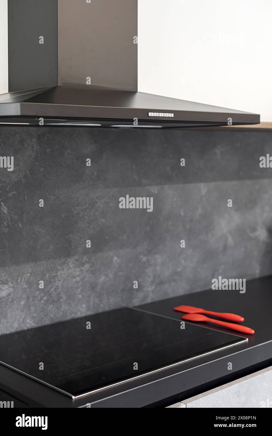 A contemporary kitchen design featuring a stylish stainless steel ...