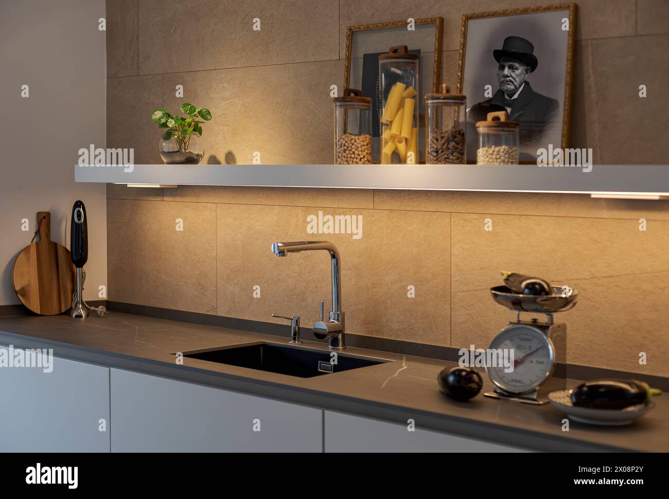 A contemporary kitchen space featuring a clean countertop with stylish ...