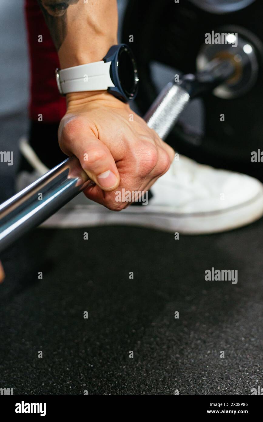 Focused shot capturing a young unrecognizable man's hand gripping a ...