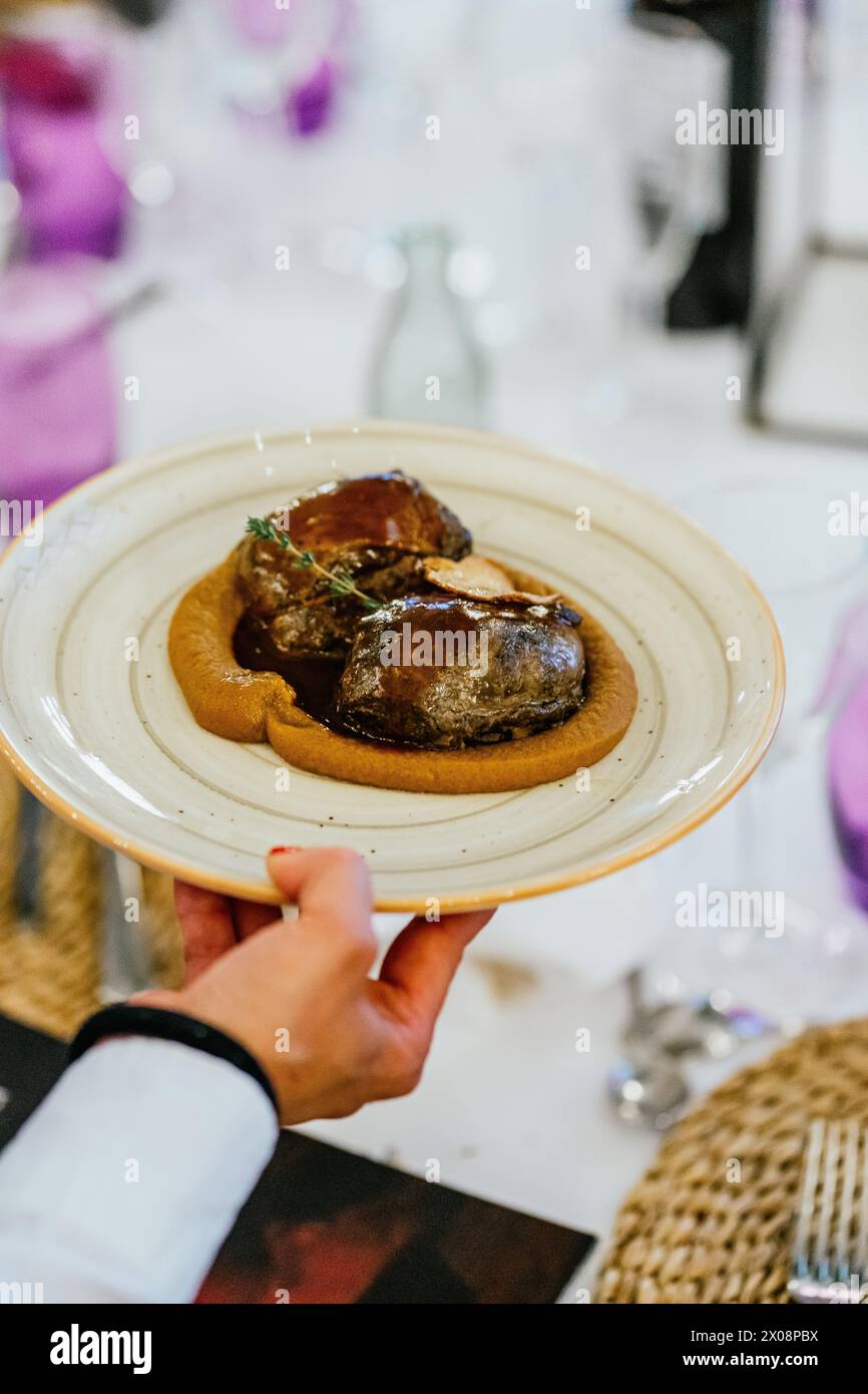 Presented on a ceramic plate hi-res stock photography and images - Alamy