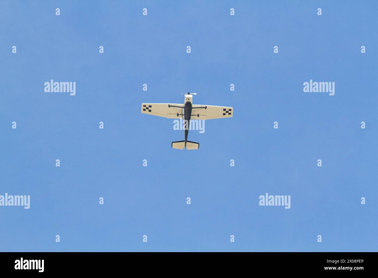 Single engine plane flying with a beautiful blue sky in Rio de Janeiro ...