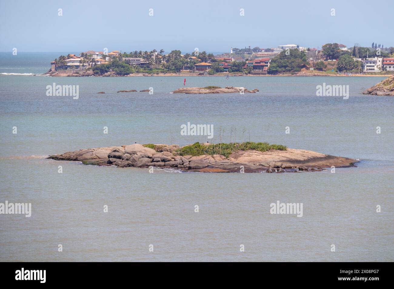 View of a small island on Camburi beach in Espírito Santo, Brazil Stock ...