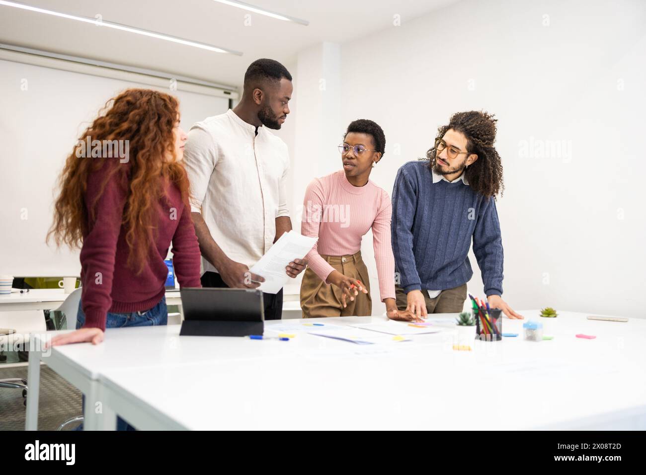 Team multicultural associates engaging in hi-res stock photography and ...