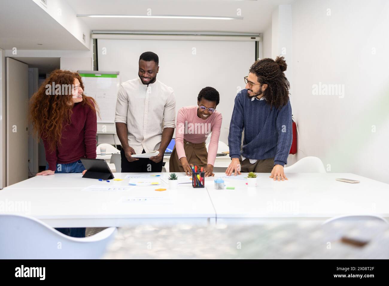 Group around whiteboard in office hi-res stock photography and images ...