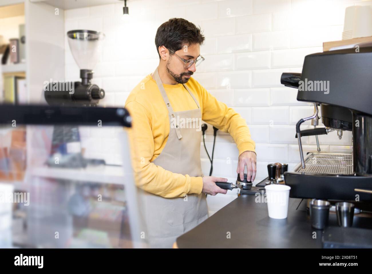 Concentrated male barista in hi-res stock photography and images - Alamy
