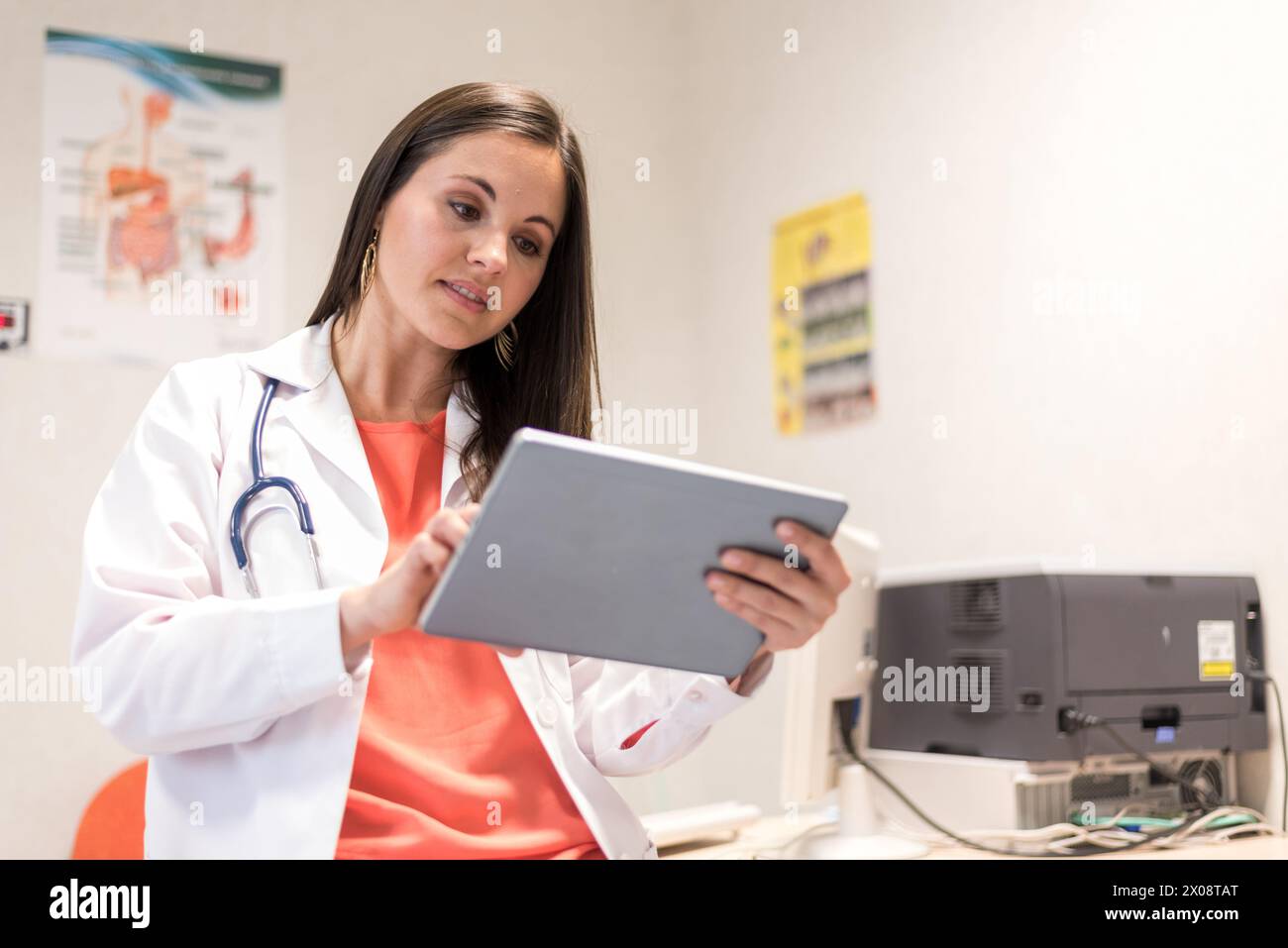 Female medic with tablet Stock Photo - Alamy