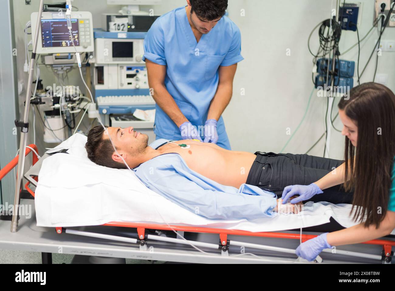 Medic preparing patient for procedure Stock Photo - Alamy