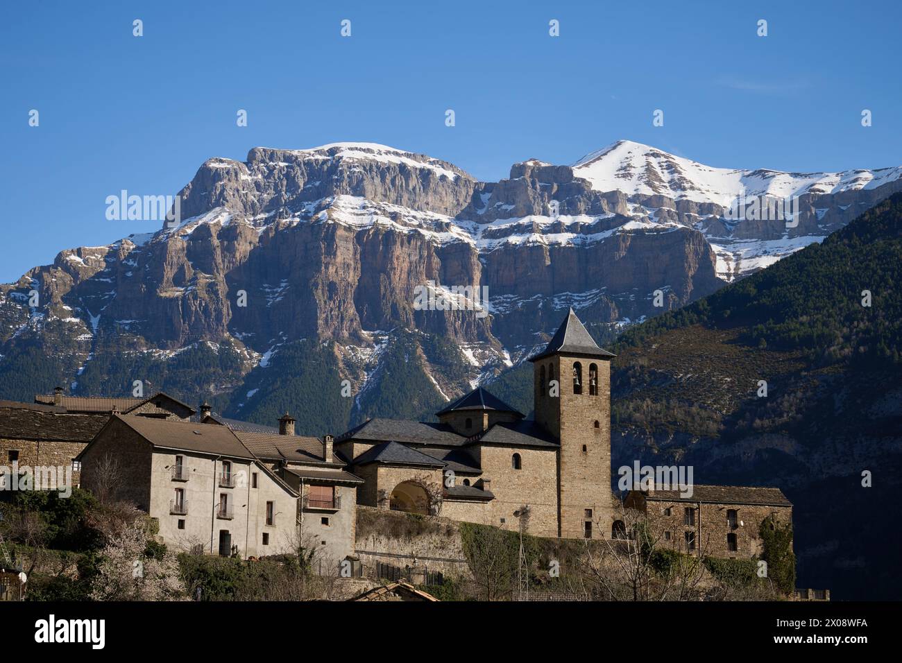 The historic village of Torla with its iconic church bell tower ...