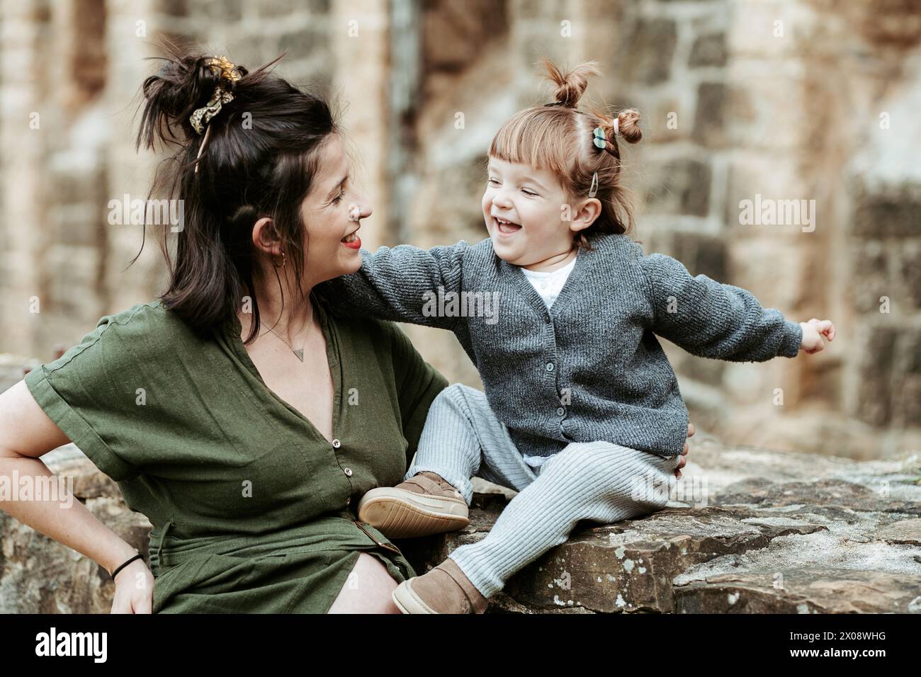 A heartwarming scene of a mother and child sharing a laugh while ...