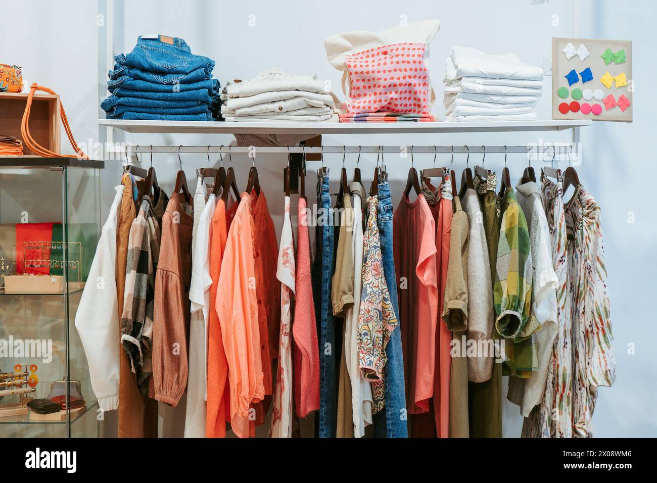 A colorful assortment of clothing items, including denim and patterned ...