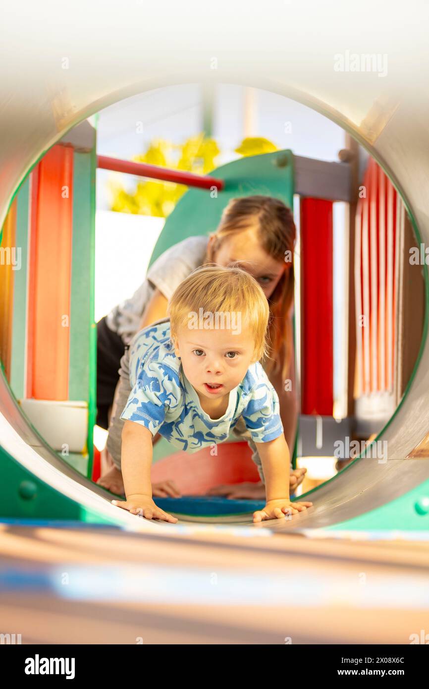 Child crawling through tunnel hi-res stock photography and images - Alamy