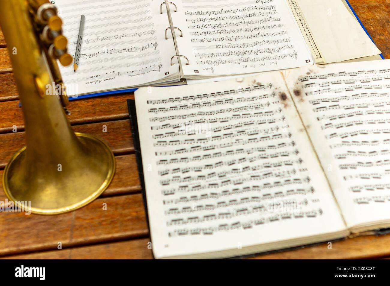 An inspirational view of a one-armed male trumpeter's music sheets and ...