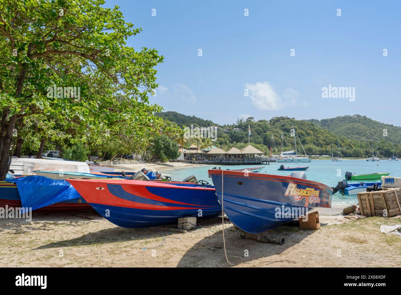 Fishing boats and Basil's Bar in Britannia Bay, Lovell Village ...