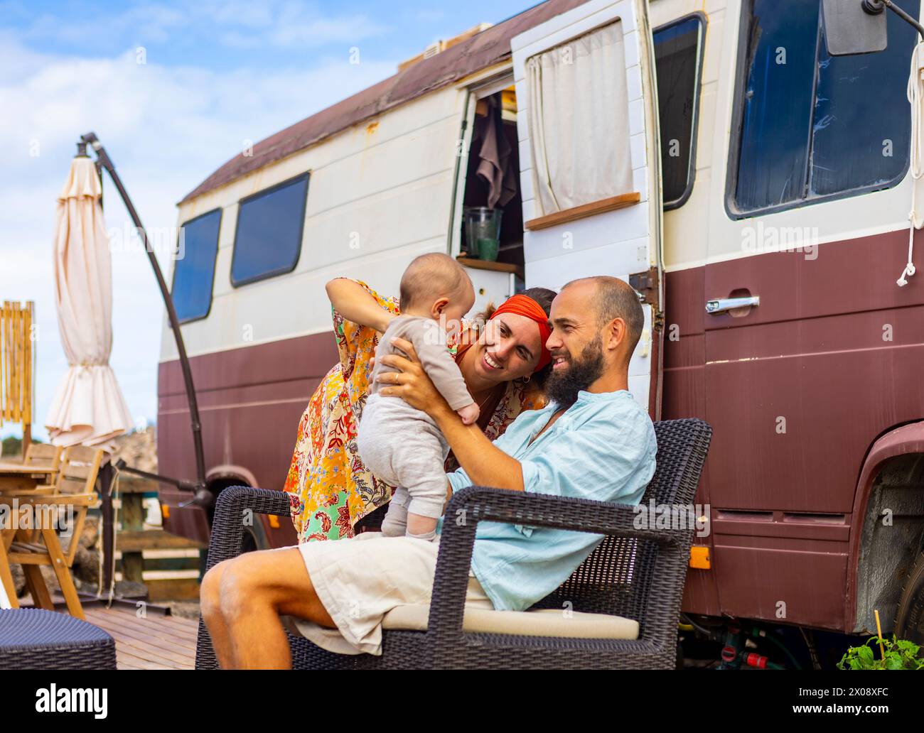 A joyful family enjoys a comfortable life in their van, featuring a ...